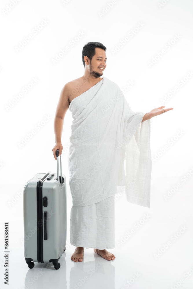 asian male with ihram presenting copyspace. hajj and umrah man concept ...