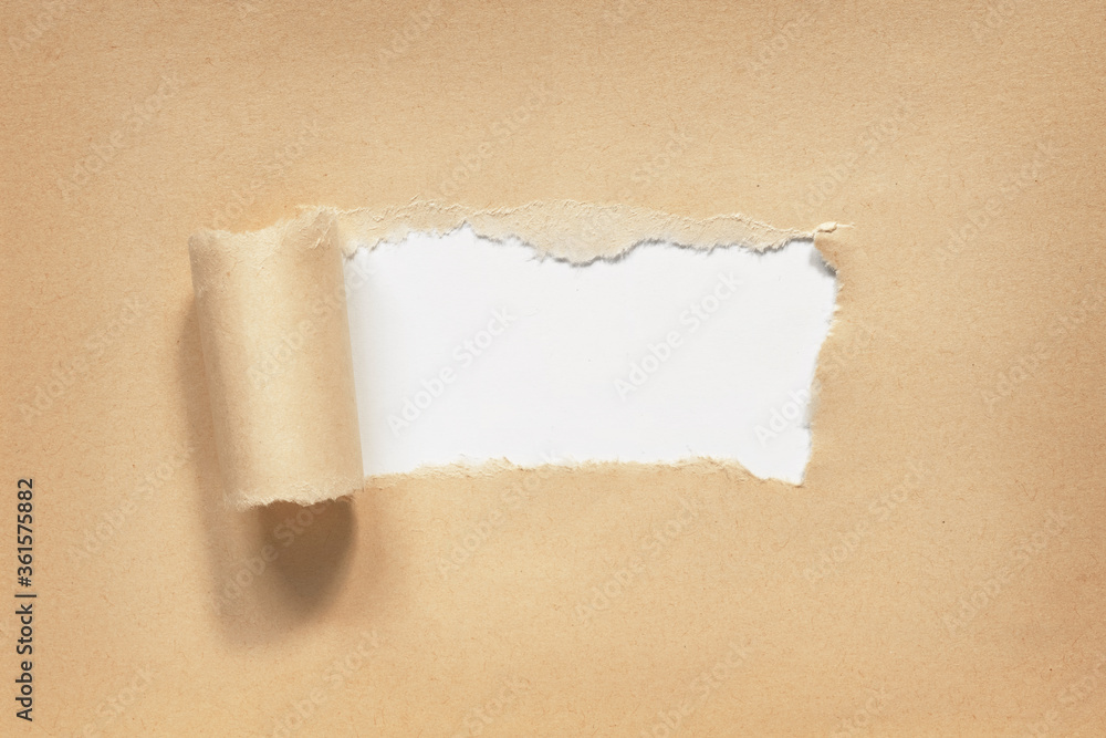 Paper torn. Hole in brown ripped paper on white background Stock Photo ...