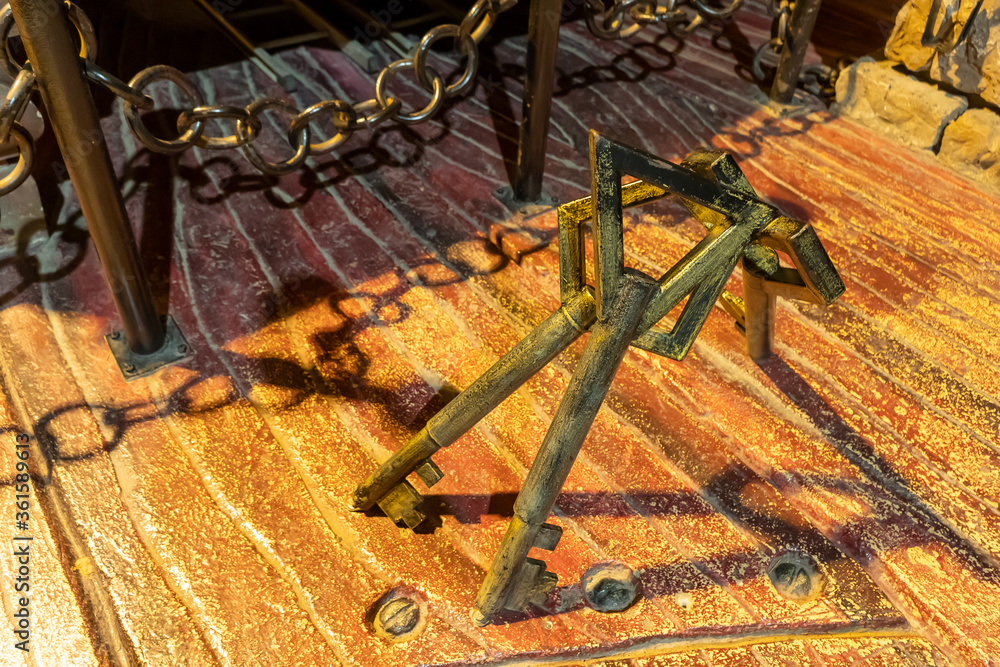 3 large keys made of iron placed on the floor of the room. Stock Photo ...
