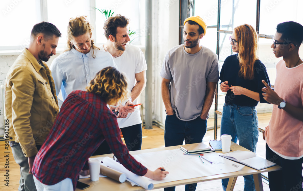 Dream team of young skilled architects collaborating in friendly ...