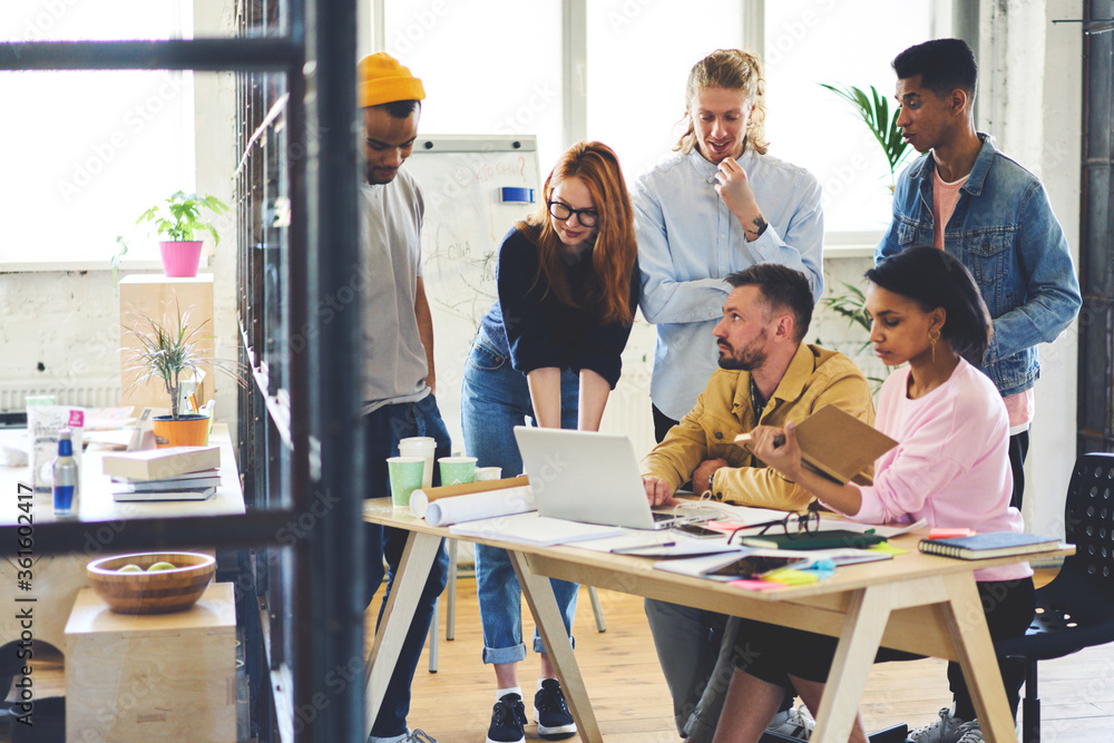 Mature male leader of diversity working group of graphic designers ...