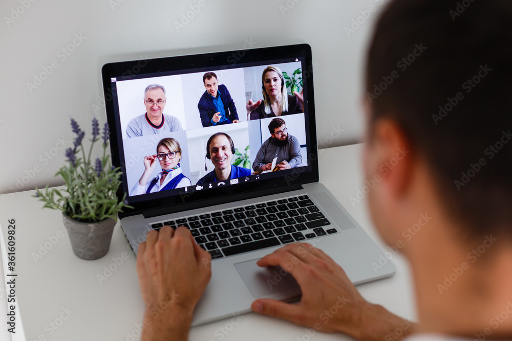 Person Using Video Conferencing technology in kitchen for video call ...