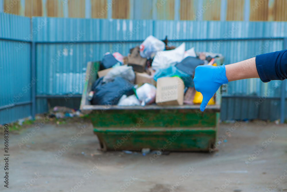 the man in the rubber gloves gave a thumbs-down sign of displeasure. a ...