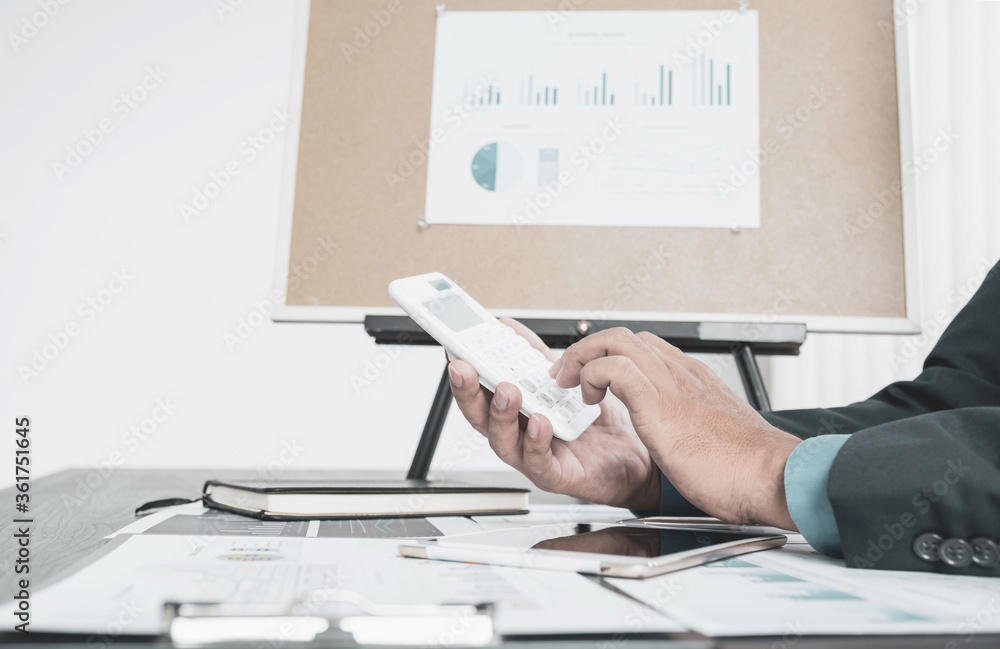 Businessman analysis the chart for Setting challenging business goals ...