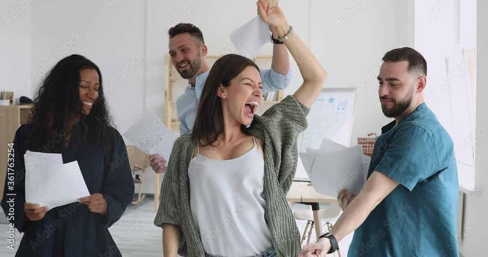 Overjoyed excited female leader and carefree multiracial business team ...