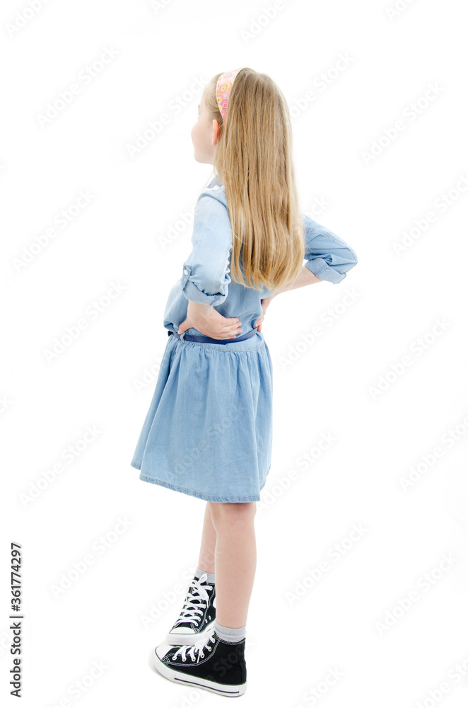 Adorable little girl looking at wall. Back view. Isolated on white ...