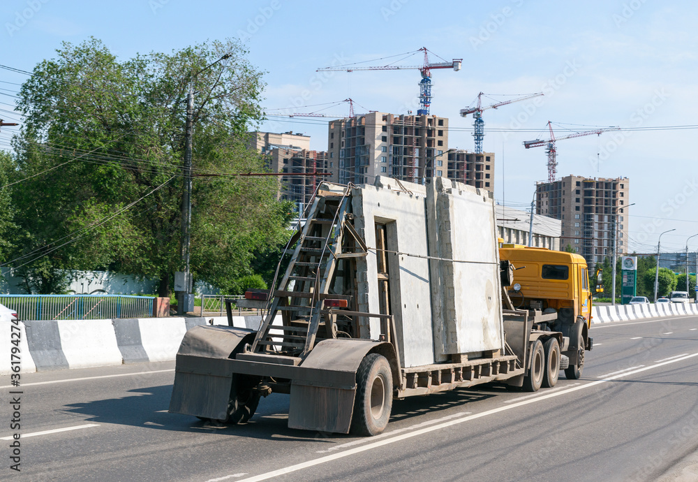 Stockfoto Freight vehicle transporting construction products: concrete ...