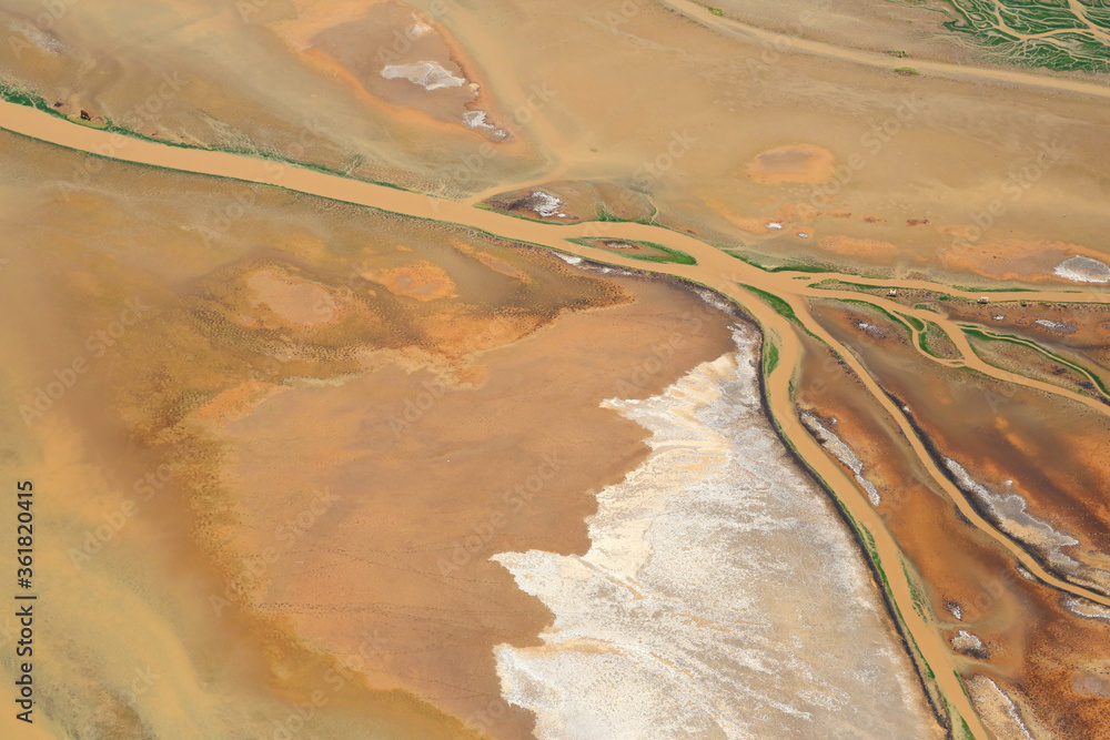 Aerial view of the salt pan and mineral crust of Lake Natron, in the ...