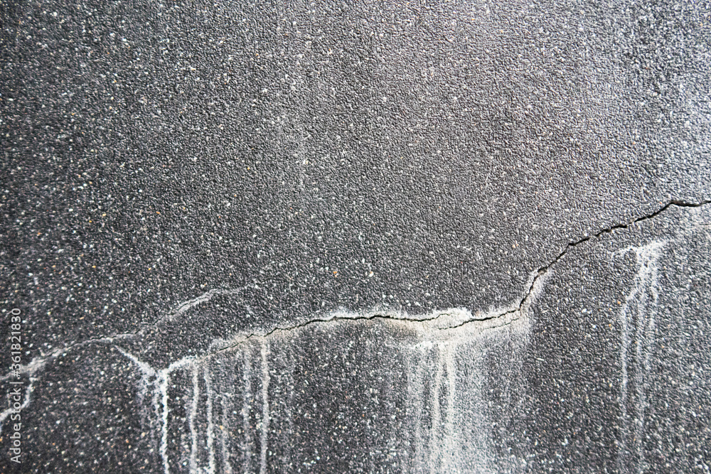 Close up Cracked wall on Shade of dark gray granite stone texture ...