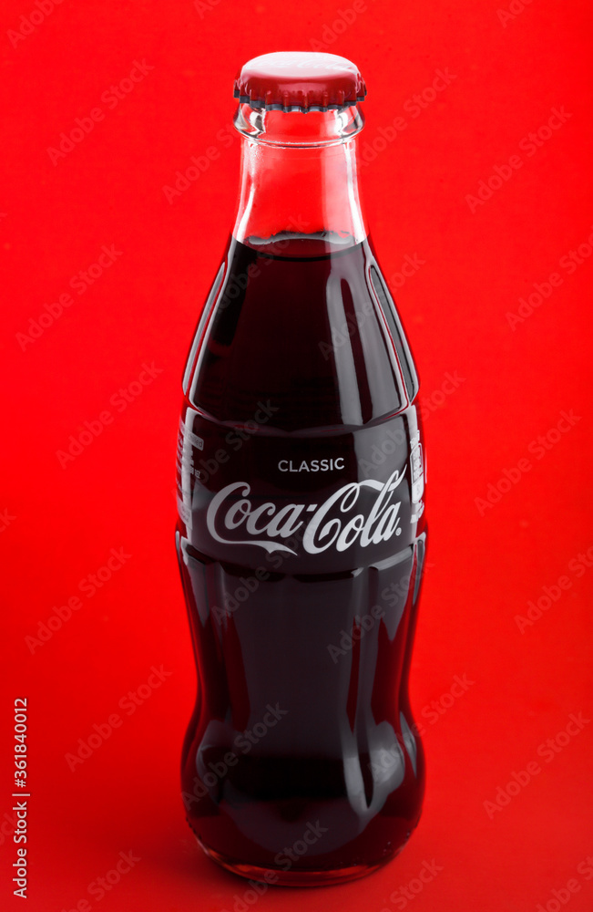 LONDON, UK -DECEMBER 07, 2017: Bottle of Classic Coca-Cola on red. Coca ...