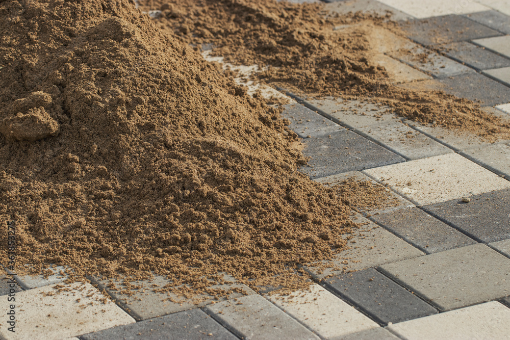 Reconstruction of a large avenue and paving slabs. Sand slide for ...