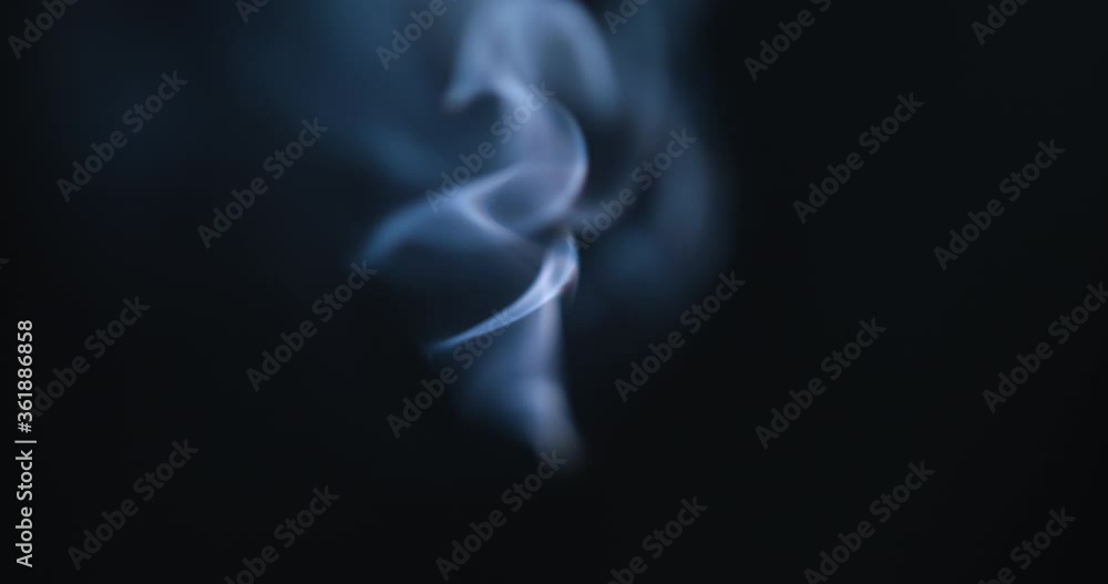 Real smoke on a black background. Thin Flexible Trickle of Real Smoke ...