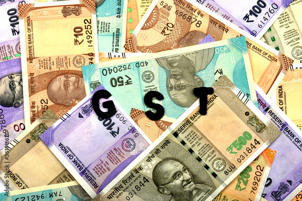 GST concept,GST alphabet on money background,business and financial ...