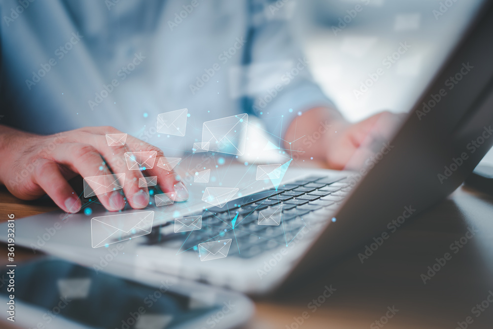 business man working on laptop computer and he is sending email in ...