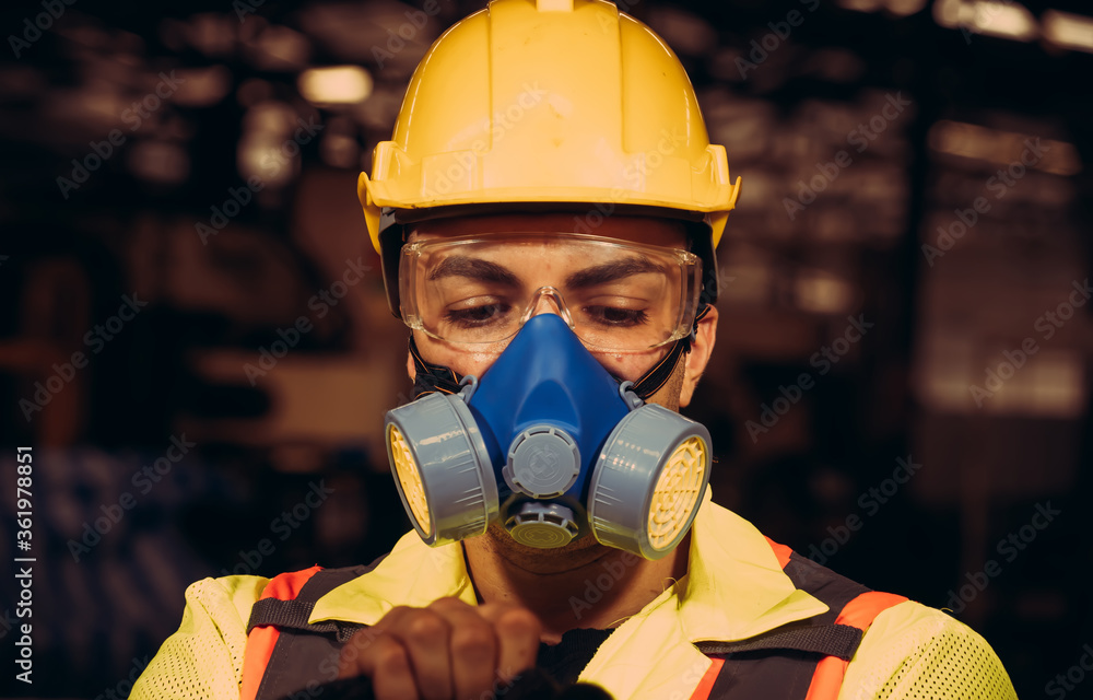 Engineers man wear protective masks to work in the factory. Stock Photo ...