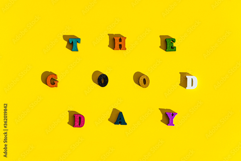 layout of wood multicolored letters is inscription of good day with ...