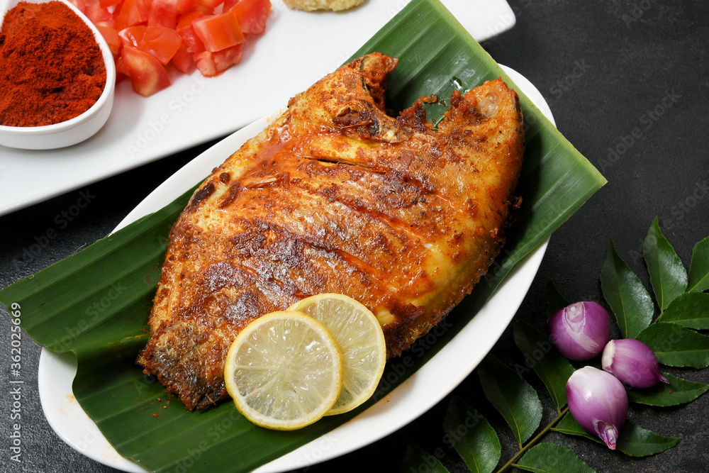 Kerala fish curry, Karimeen Pollichathu a popular hot and spicy baked ...