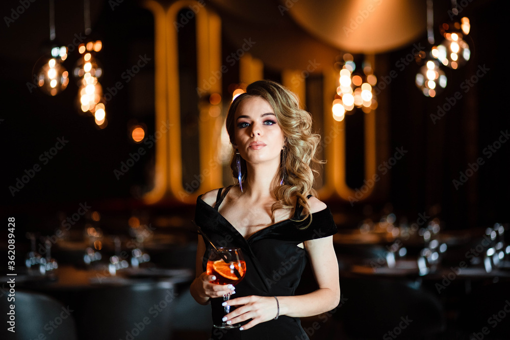 Beautiful Blonde Young Girl Holding An Aperol Spritz Cocktail Aperol