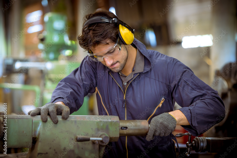 The Industry worker wearing safety uniform used Vernier caliper to ...