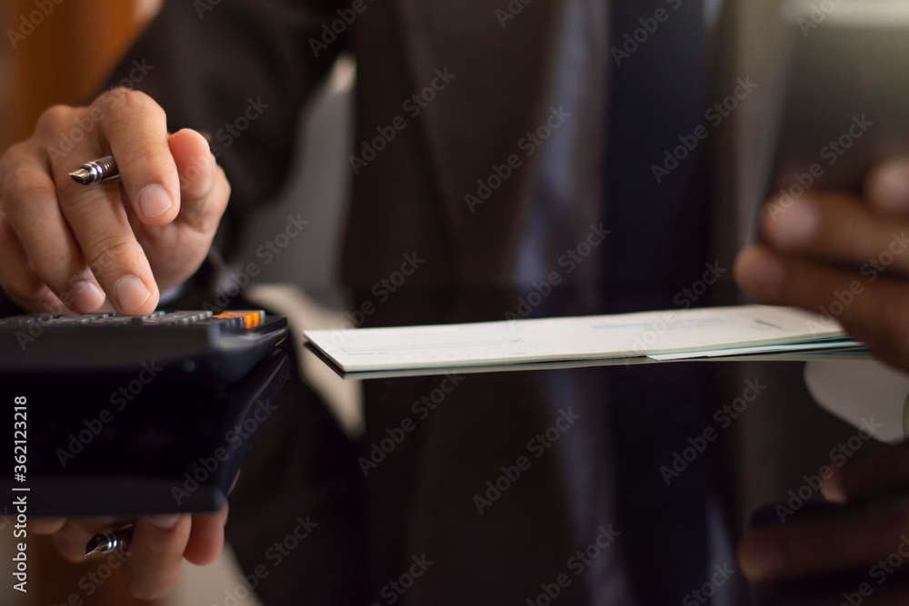 Businessman hand holding mobile smart phone, write and signed blank ...