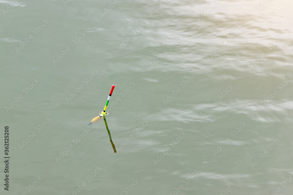 Fishing float (bobber) against the background of water close-up. small ...