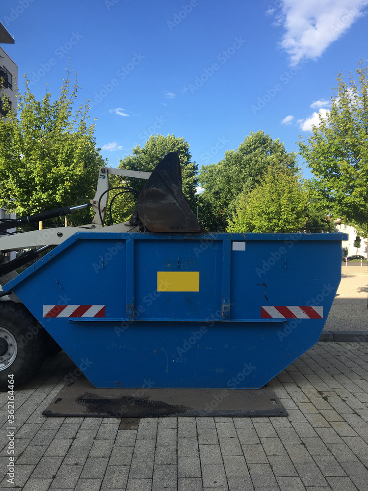 Blue skip container for the transportation of various waste and ...