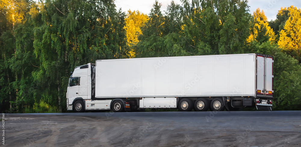Semi-trailer truck moving along a suburban highway Stock Photo | Adobe ...