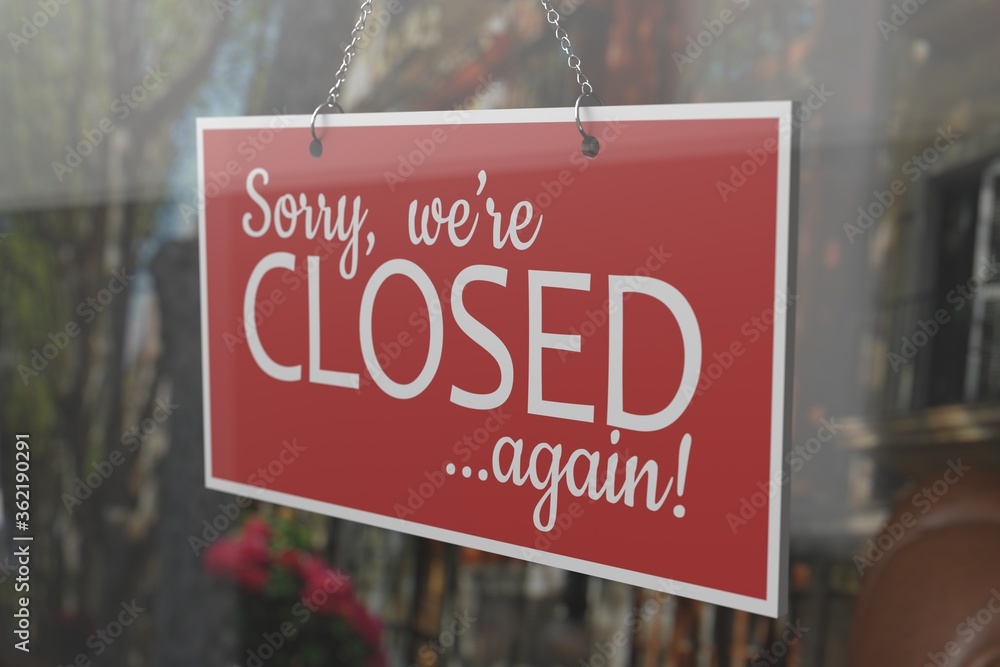 We're closed again red door sign hanging on a glass door in a store ...