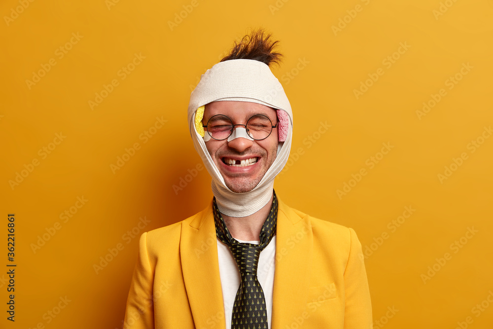 Health care and injury concept. Happy positive young man smiles broadly ...