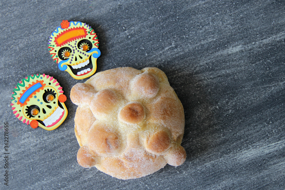 Mexican sweet bread, pan de muerto, papel picado and traditional skulls ...