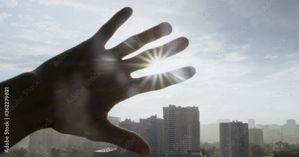 Man Playing with Sun Rays. Palm Covers Sun. Through Fingers Passes Rays ...