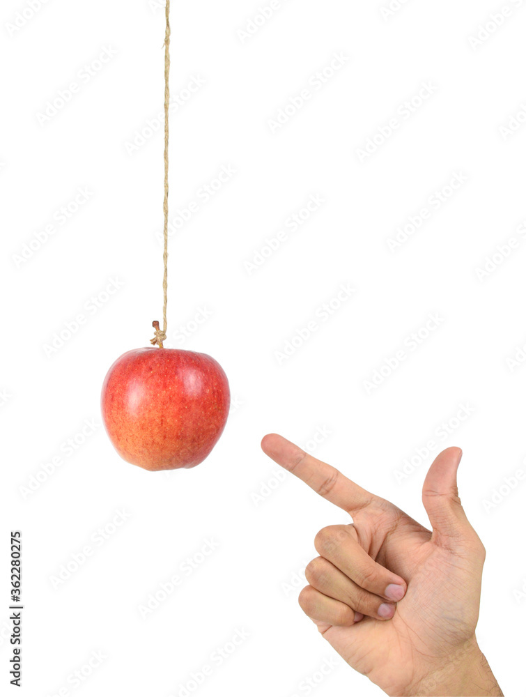 Human hand point the hanging apple isolated on white background. Low ...