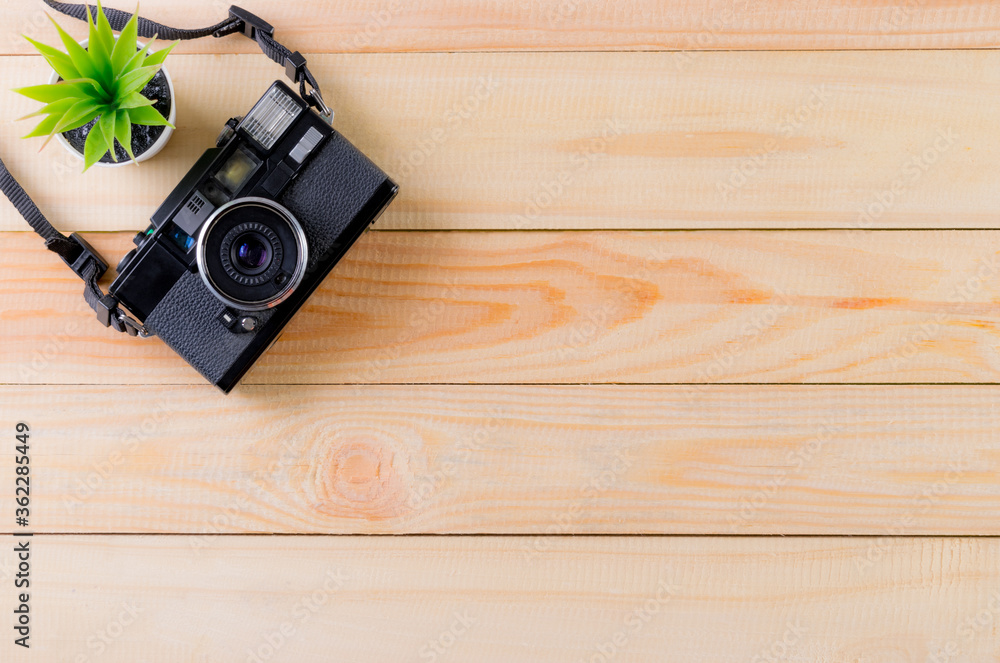 Vintage camera on wooden table background with copy space. World ...