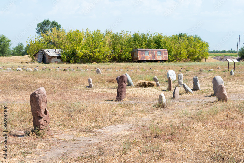 Kurgan stelae at Ruins of Balasagun in Tokmok, Kyrgyzstan. Balasagun is ...