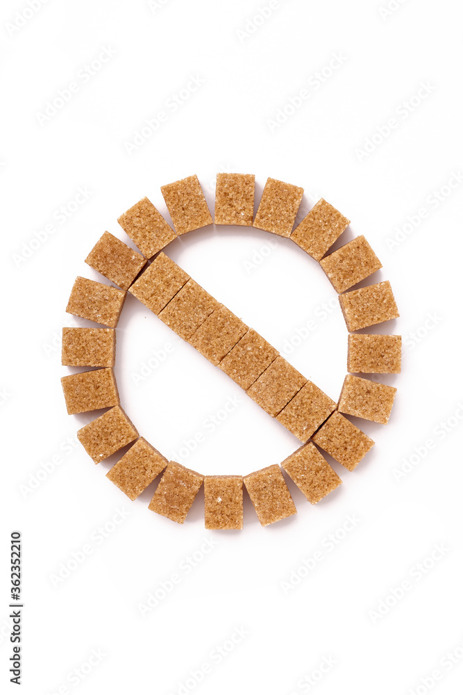 Cubes of brown sugar displaying a danger no entry caution logo stop ...
