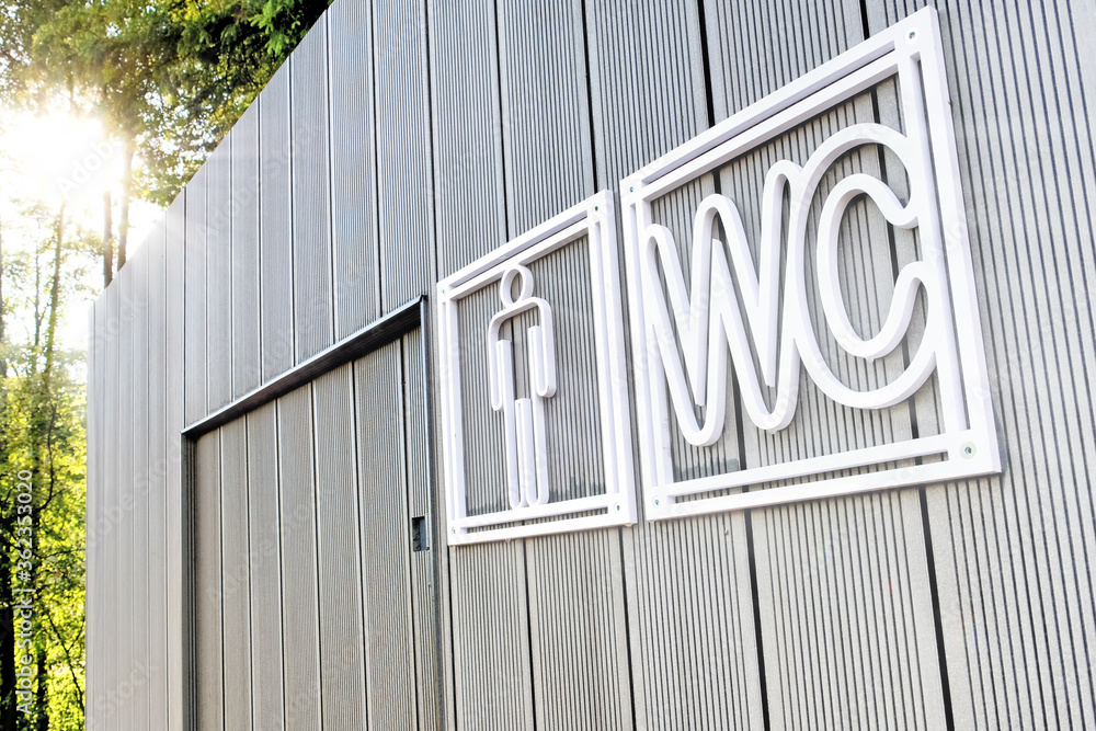 public toilet building against forest background. Front closeup view of ...