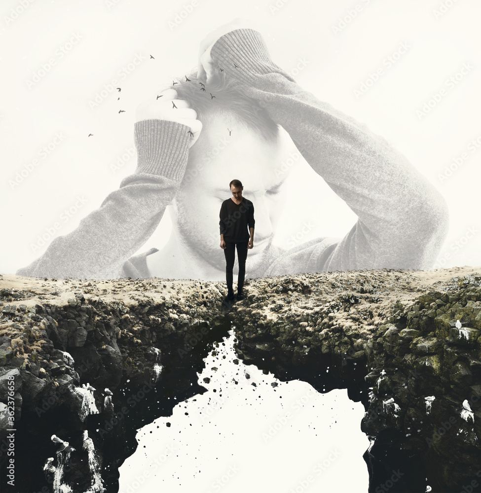 Man standing close to the edge on cliff. Ground is destroying under his ...