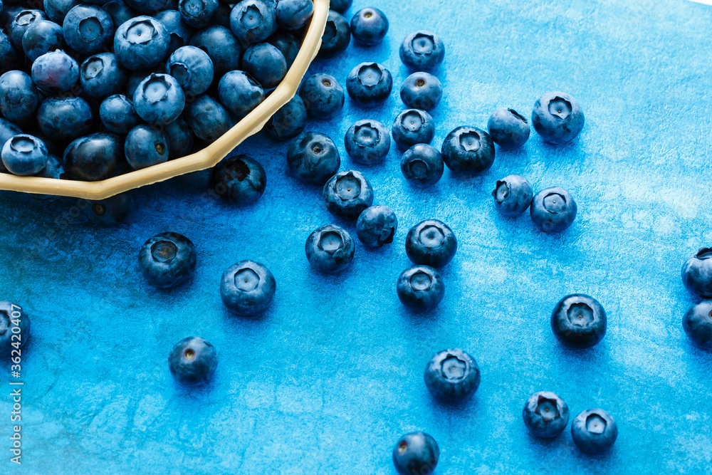 Blueberries on colorful blue background. Can be used for blueberry ...