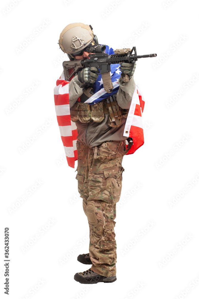 American soldier in uniform and with a rifle aims and shoots, a special ...