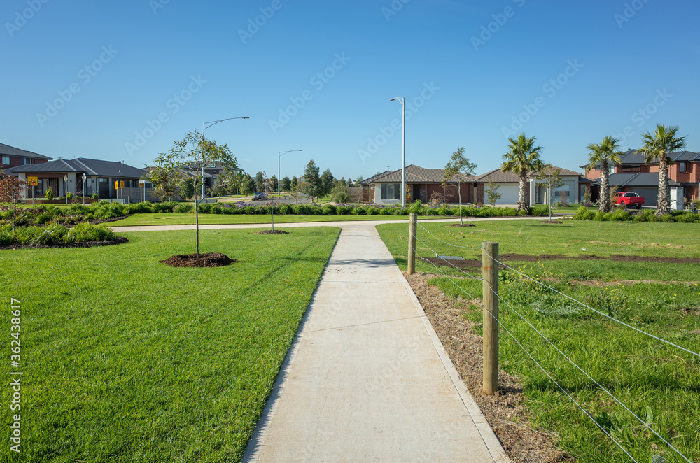 A pedestrian walkway/footpath leads to a residential neighbourhood with ...