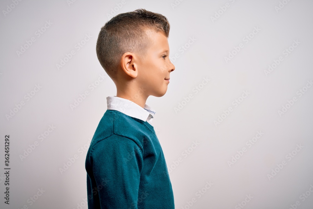 Young little caucasian kid with blue eyes standing wearing elegant ...
