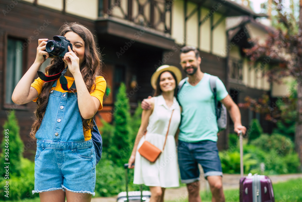 Nice photo. A photo of a happy travelling family with suitcases with a ...