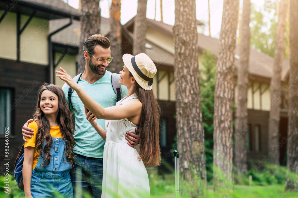 Summer trip. A photo of a happy family on a weekend staying toghether ...