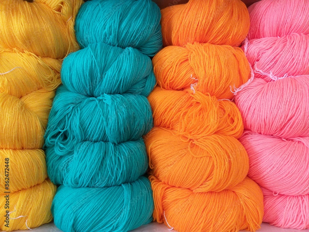 Stack of colorful knitting wool, Knitting is a method by which yarn is ...