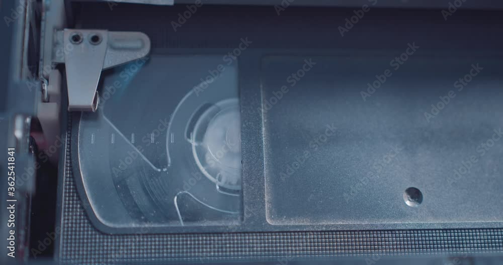 Inserting VHS video tape into retro VCR player Stock Video | Adobe Stock