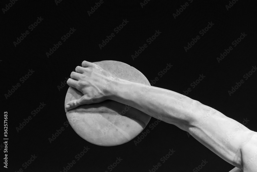 Black and white photo showing in detail hand of ancient roman statue ...