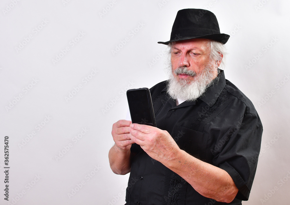 Fine dressed man reading text from his smartphone.Man checking messages ...