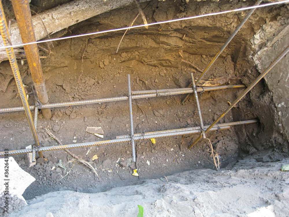 Large pit for pouring concrete under the foundation of the building ...