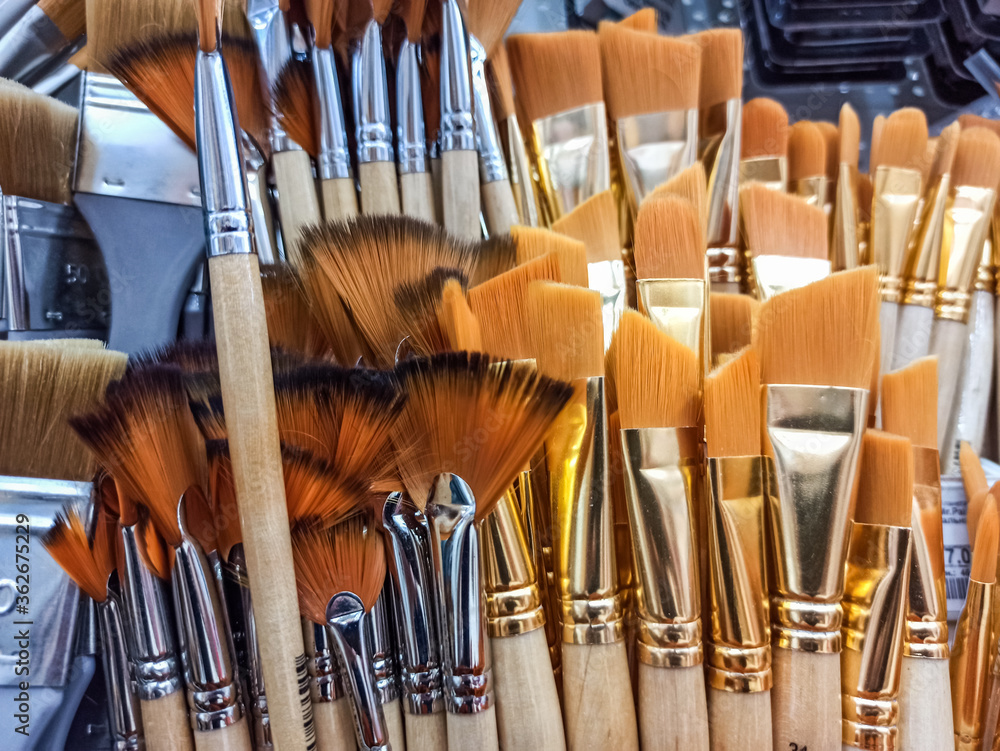 Group of artistic paintbrushes for artist. New paint brushes on shelf ...
