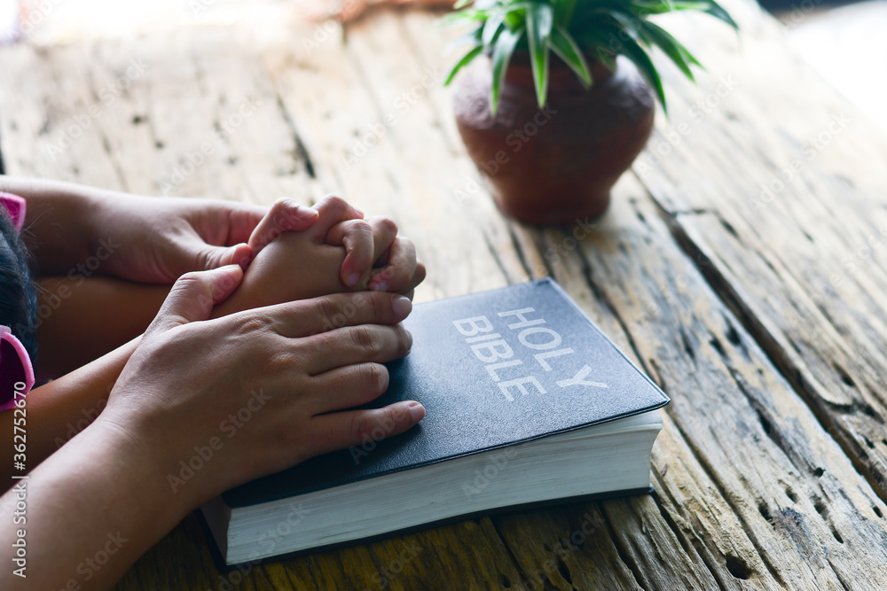 Baby hand holding in mother hands for prayer. Stock Photo | Adobe Stock